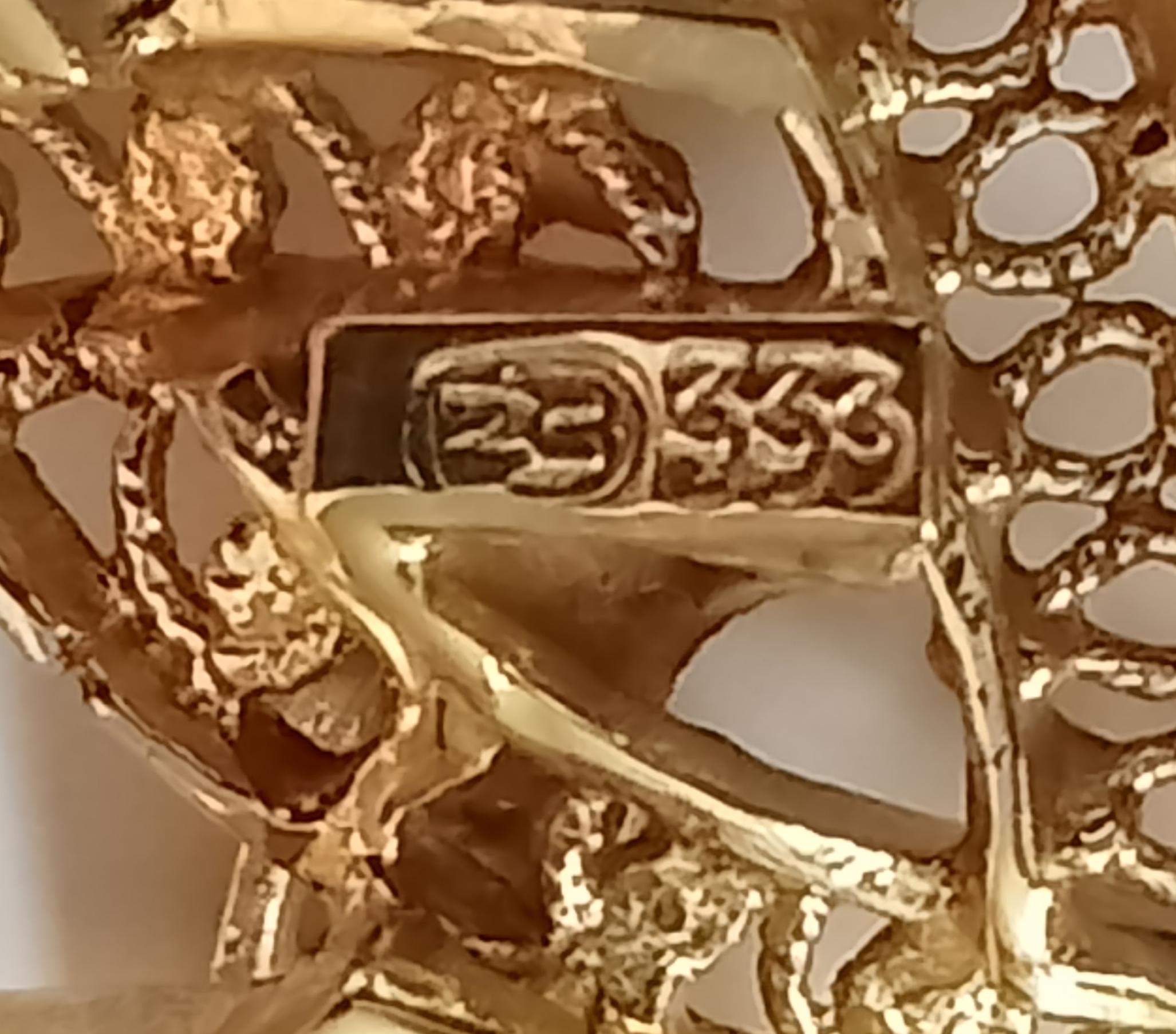 Punze auf Brosche, die zweite. Was bedeutet sie? (Gold)