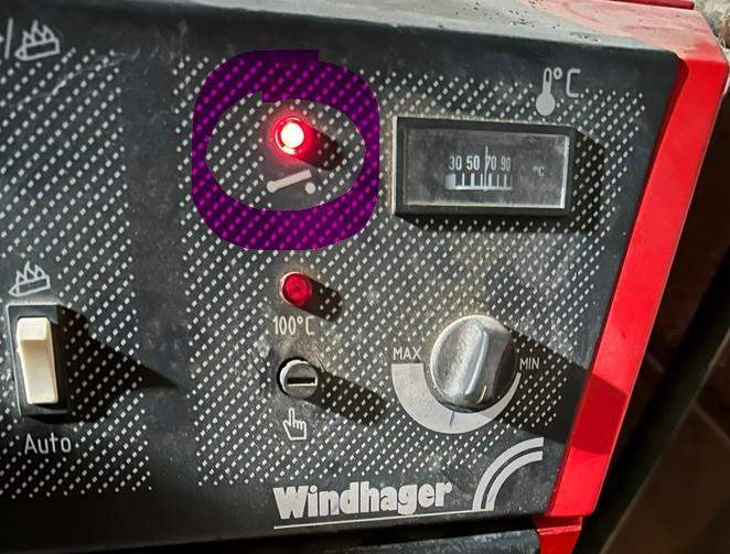 Was bedeutet dieses Symbol bei Windhager Ökomix SRX? (Heizung, Heizungsanlage)